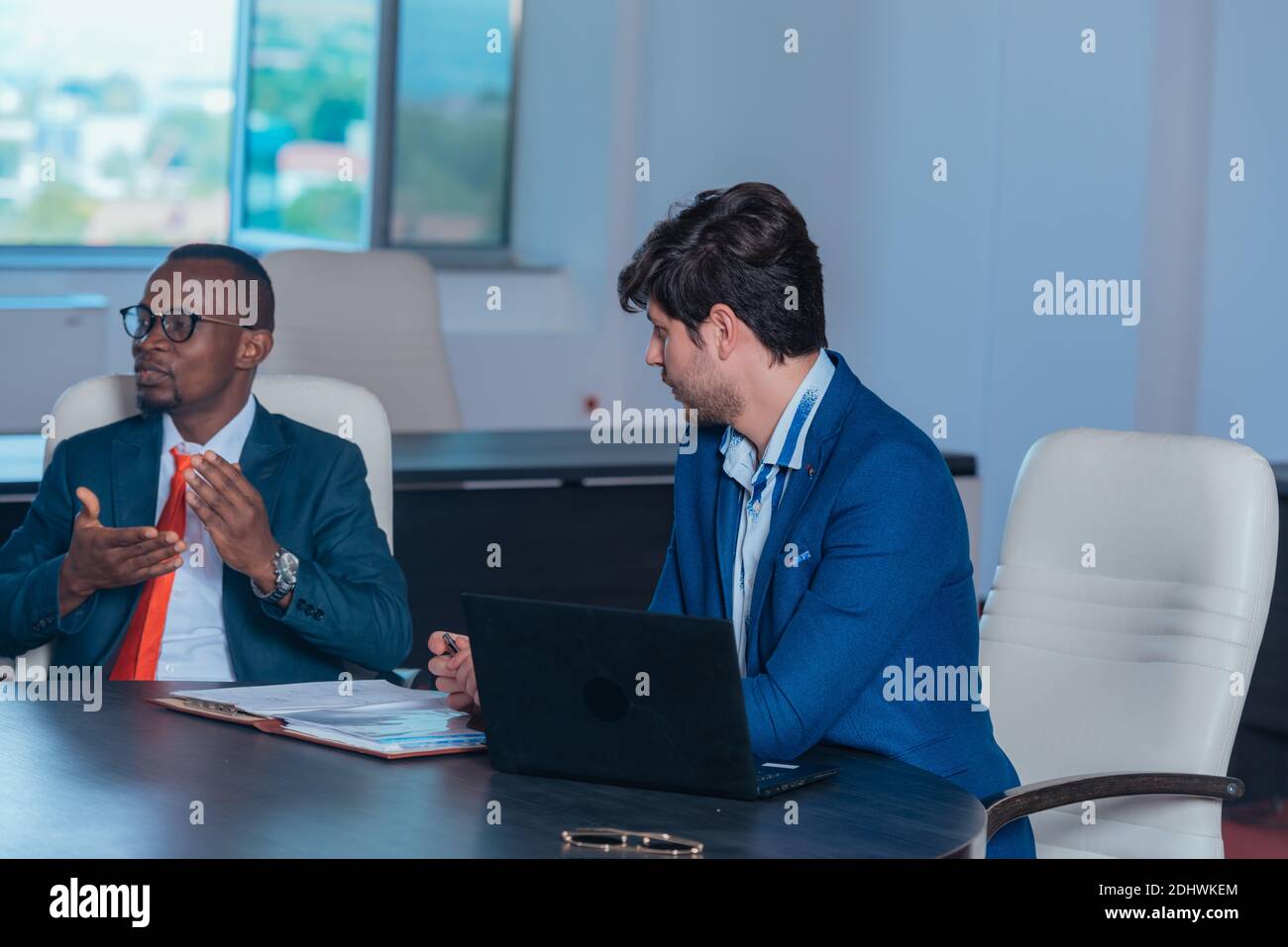 Corporate business team and manager in a meeting. Team building meeting ...