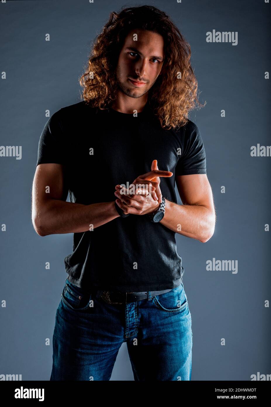 Body shot of an attractive male model posing in modern style clothing ...