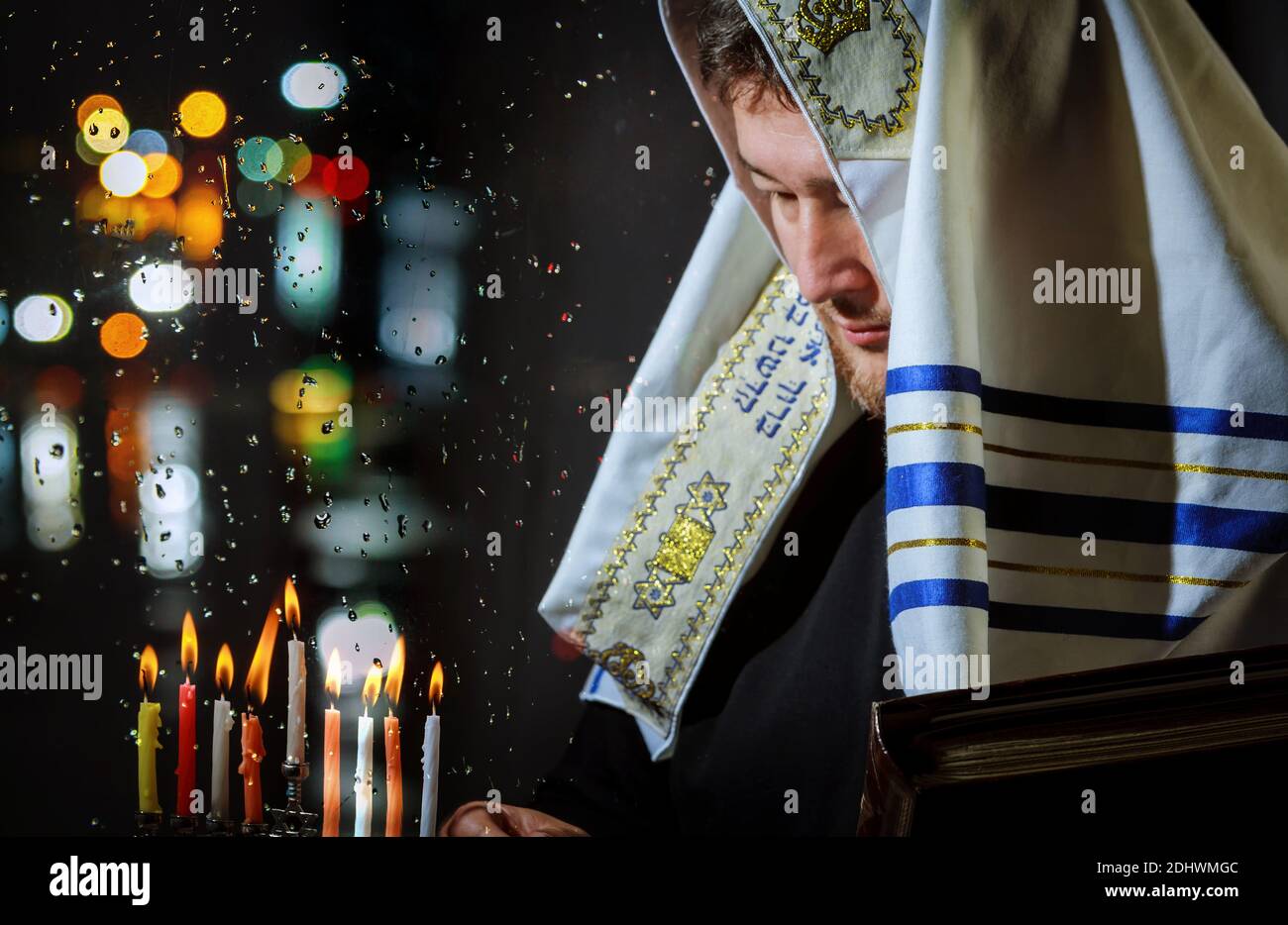 Jewish Religion holiday symbol for lights man hand lighting candles in ...