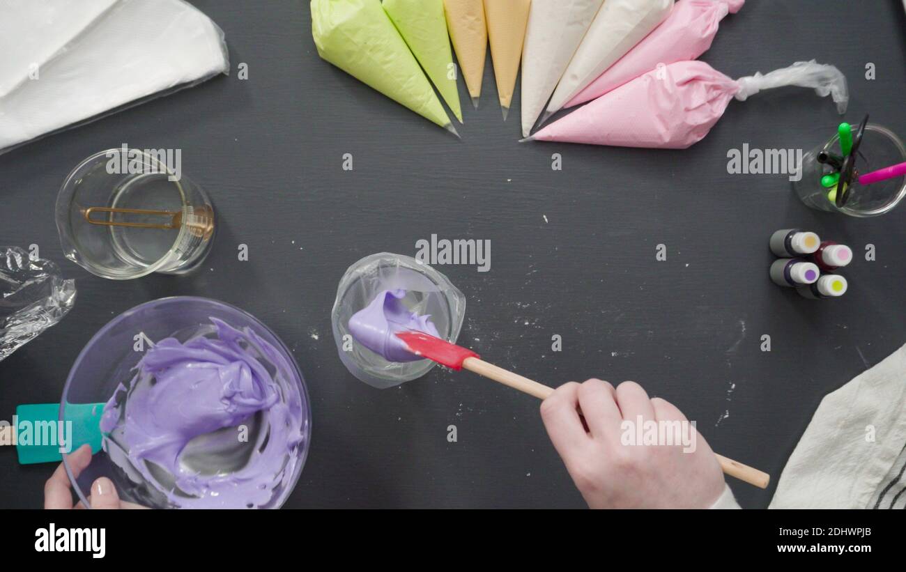 Step by step. Flat lay. Pouring royal icing into the piping bag to ...