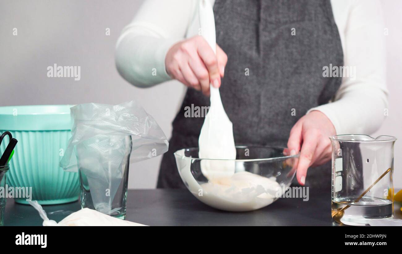 Step by step. Mixing in food coloring into the royal icing to decorate ...
