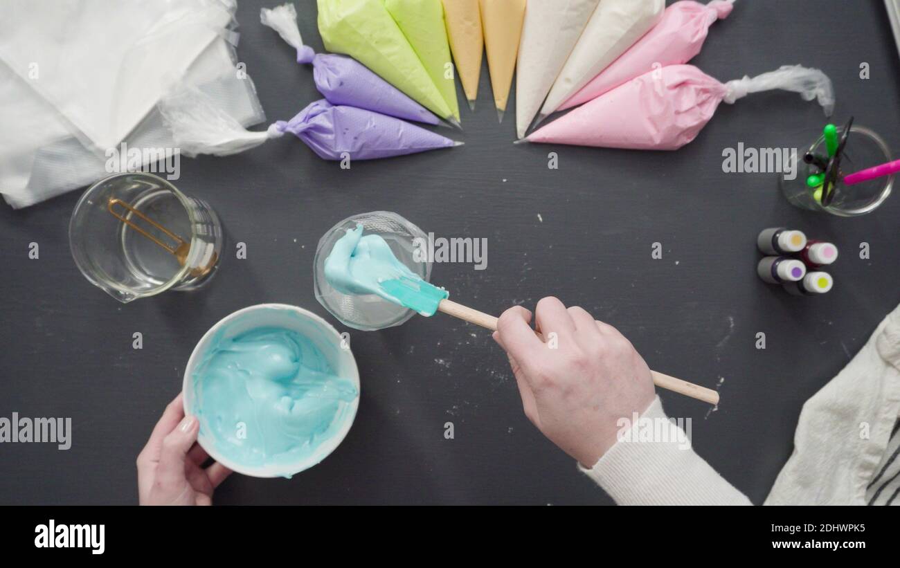 Step by step. Flat lay. Pouring royal icing into the piping bag to ...