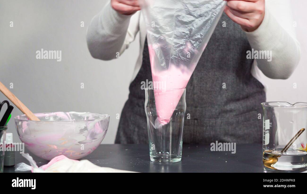 Step by step. Pouring royal icing into the piping bag to decorate sugar ...