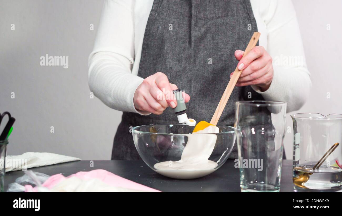 Step by step. Mixing in food coloring into the royal icing to decorate ...