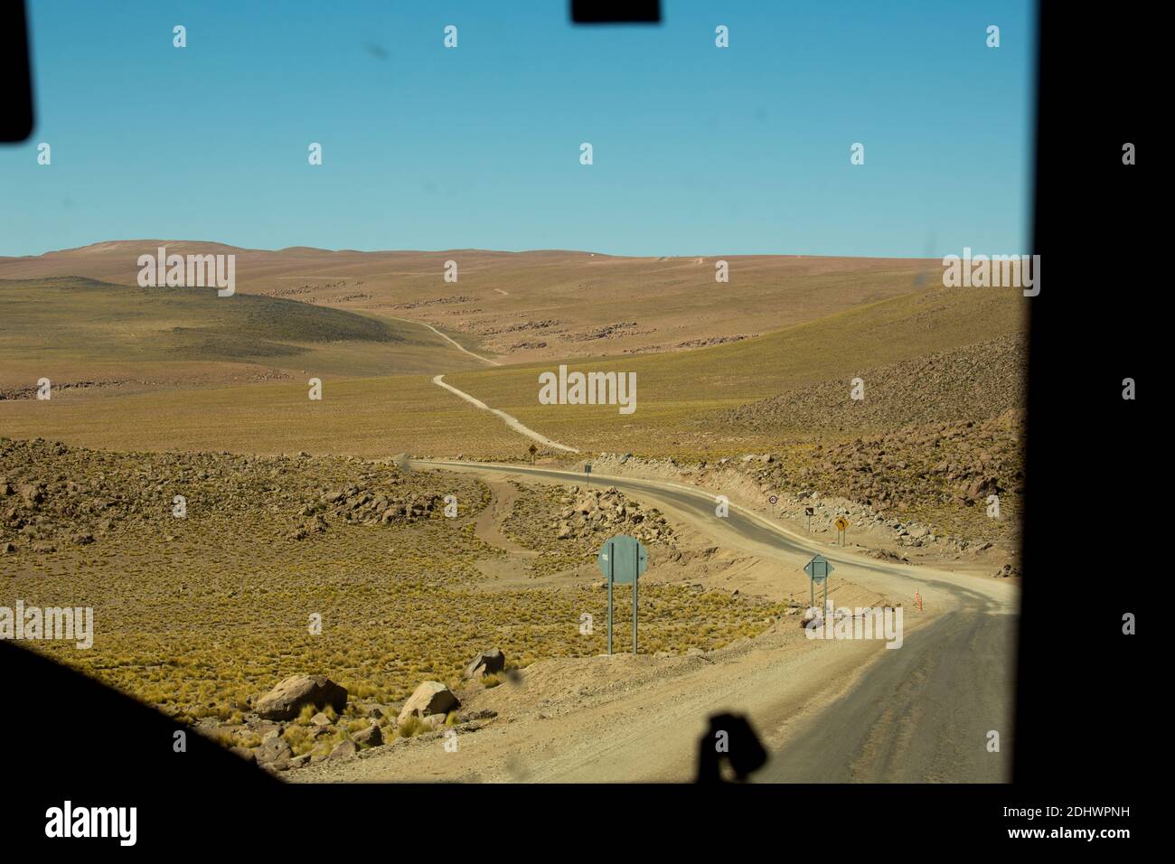 A high altitude desert road in the Andes in the Atacama desert ...