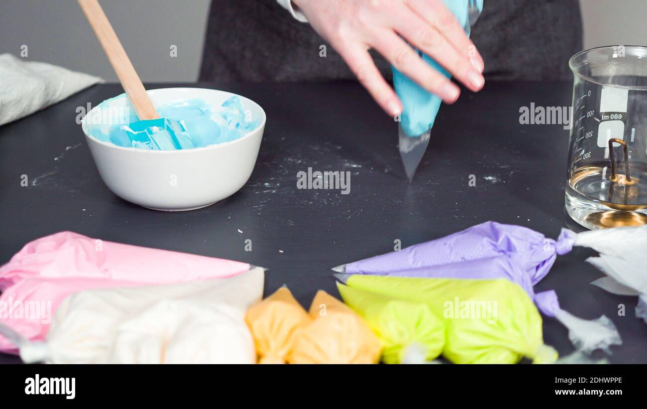 Step by step. Pouring royal icing into the piping bag to decorate sugar ...