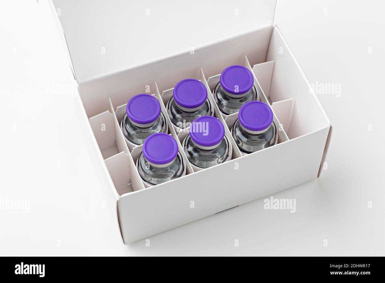 Box with Covid19 vaccines on white background, ready for vaccination ...