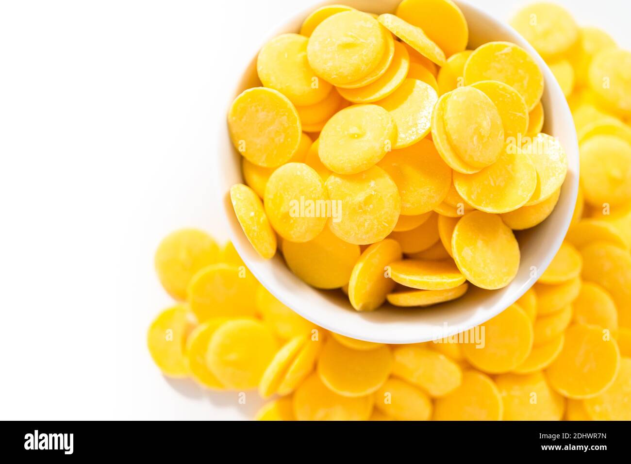 Yellow round chocolate chips for melting chocolate shapes Stock Photo ...