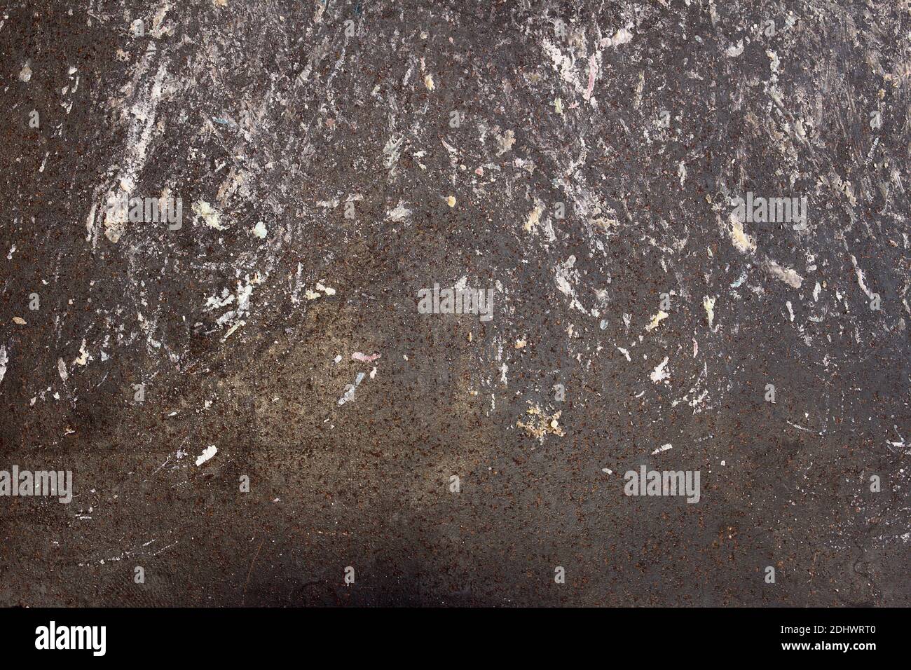 Abstract landscape of peeling blue paint on a rusty and stained metal ...