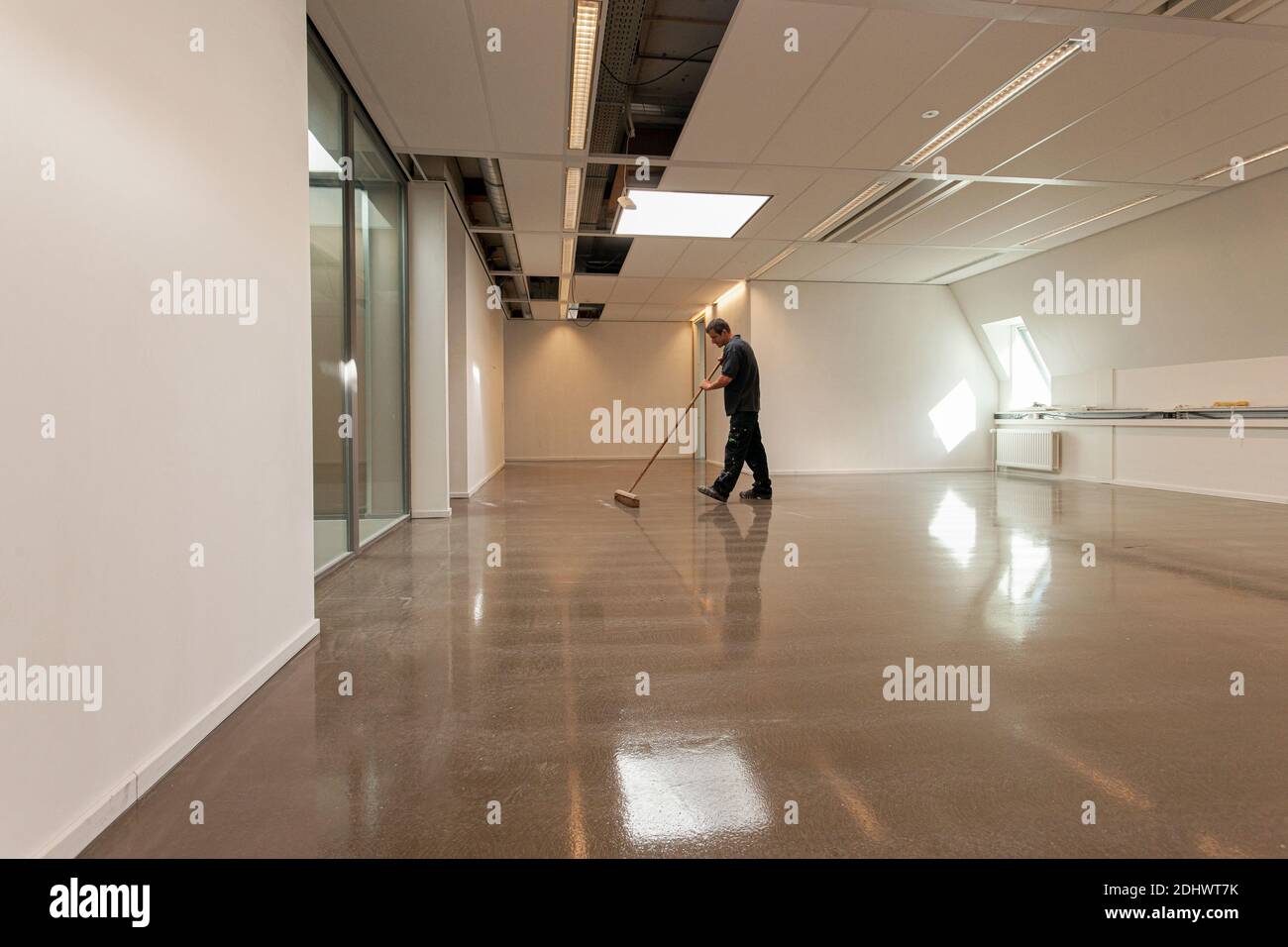 LAREN, THE NETHERLANDS - MAY 16, 2012: Construction workers applying a ...