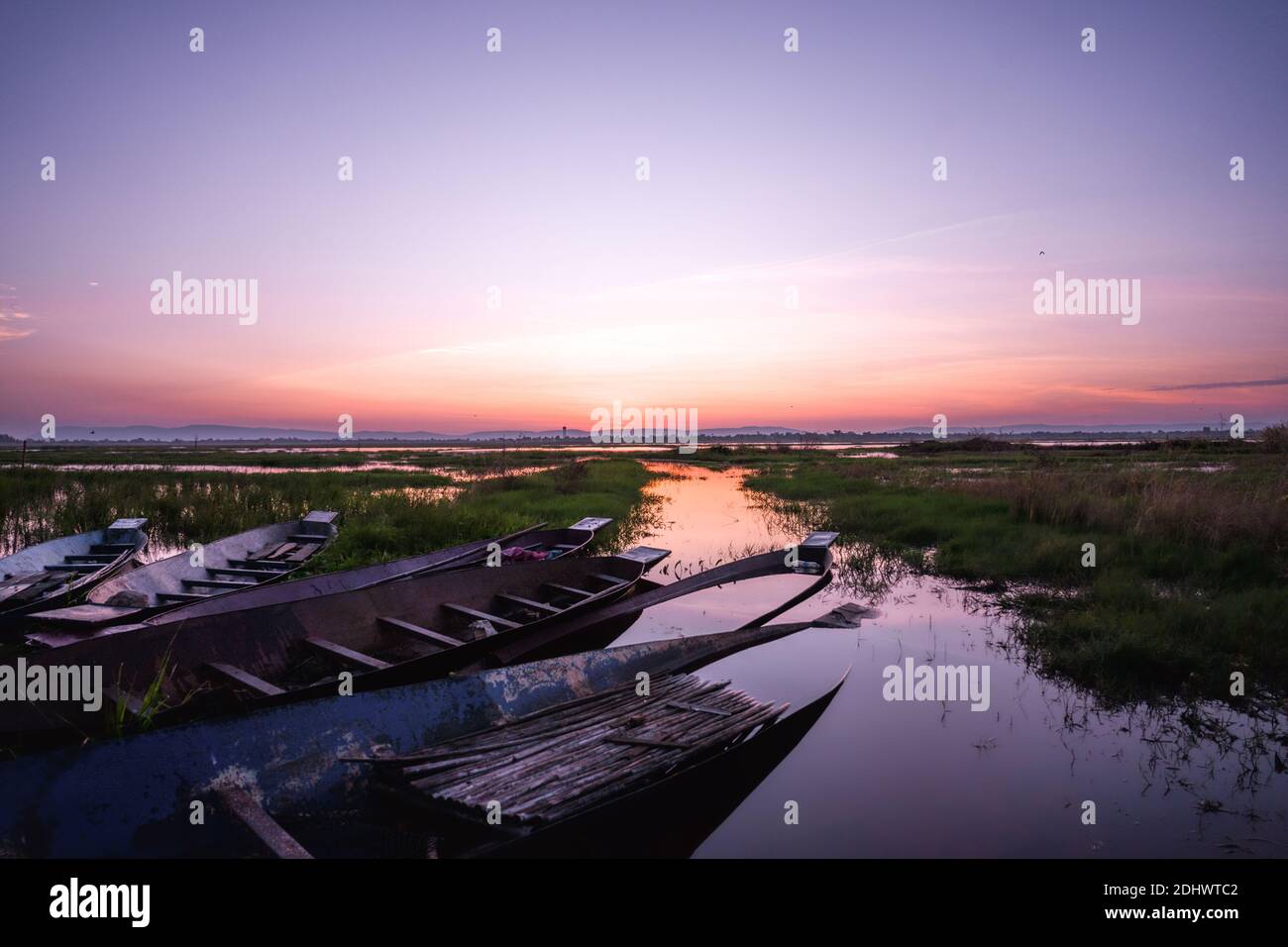 sunrise on small lek with fishing boat Stock Photo - Alamy