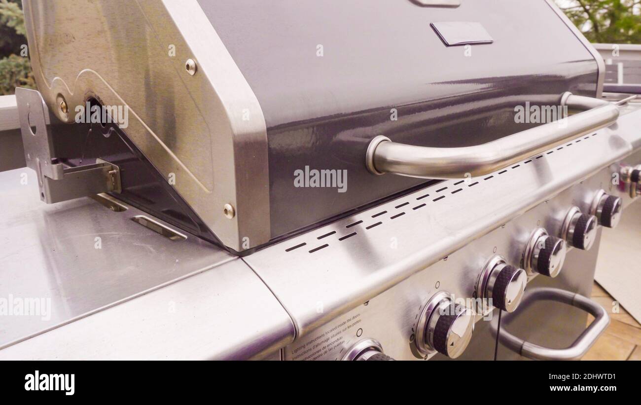 Cooking bacon stips on an outdoor gas grill Stock Photo - Alamy