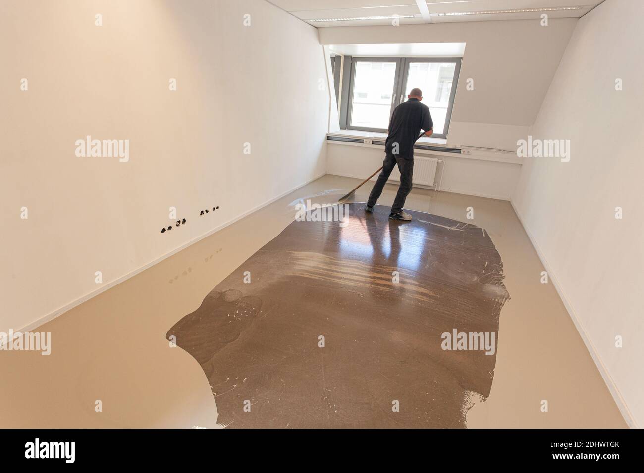 LAREN, THE NETHERLANDS - MAY 16, 2012: Construction workers applying a ...