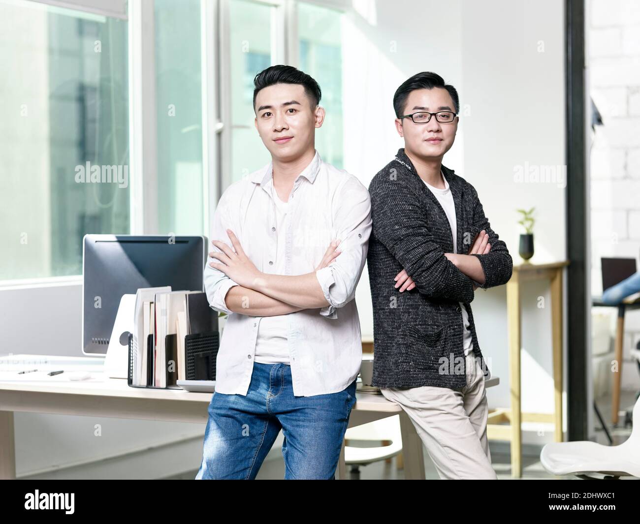 Two men standing with arms crossed hi-res stock photography and images ...