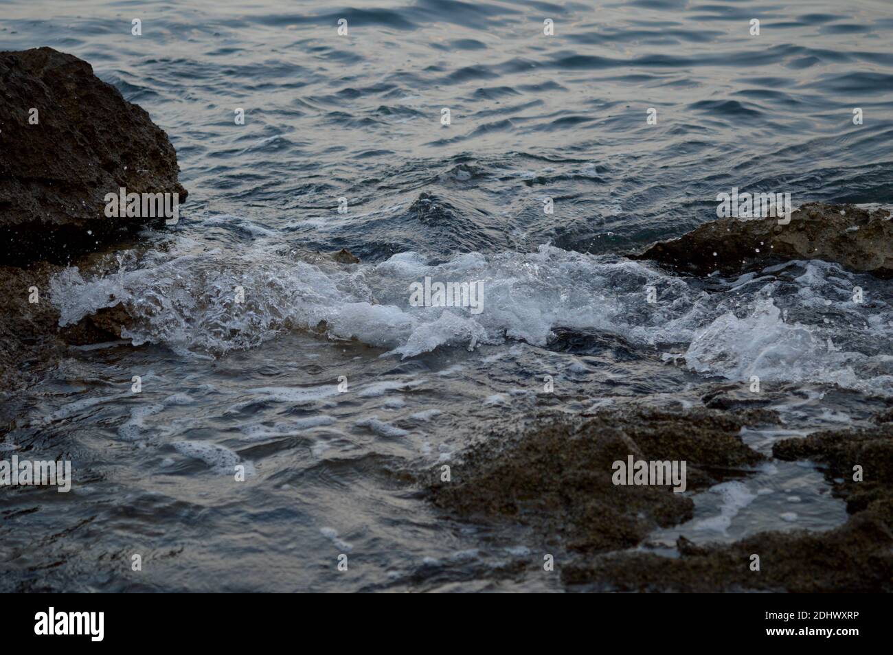 Close up. Sea waves crashing into rocks. Storm at the sea, dark, moody ...