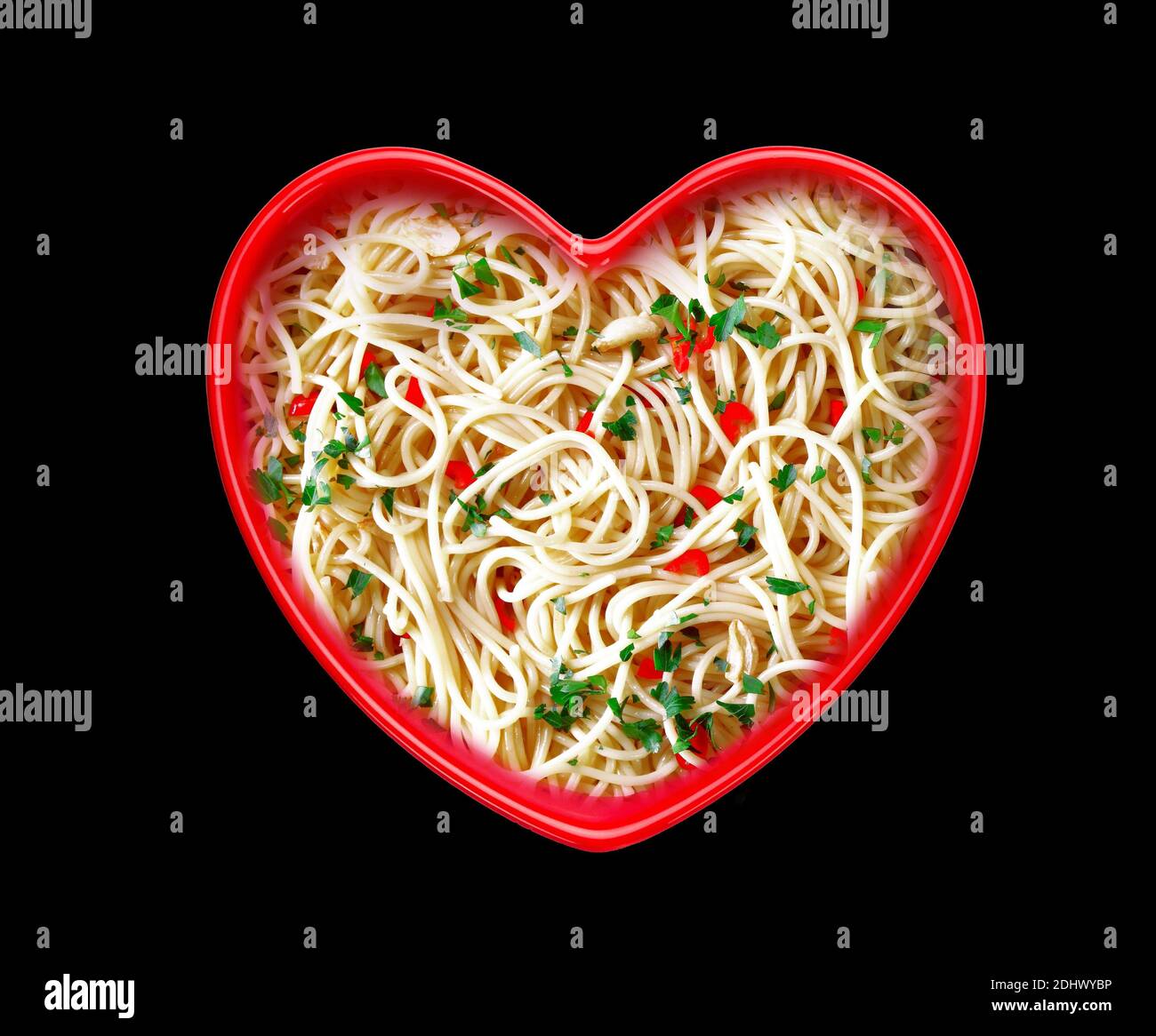 Yummy! Isolated spaghetti in heart shape red bowl Stock Photo - Alamy