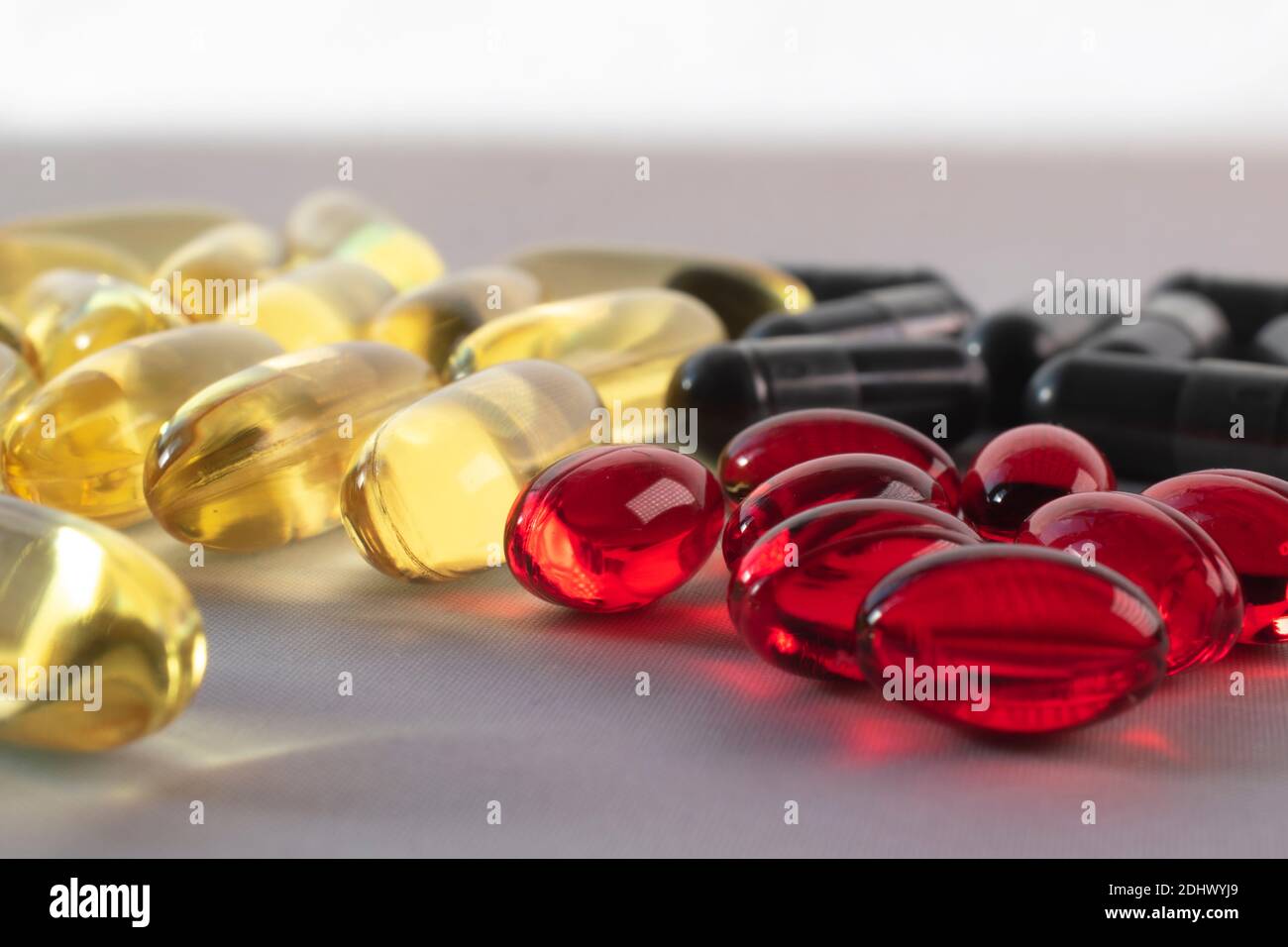 Stack of pills and medicine of various sizes and colors Stock Photo - Alamy