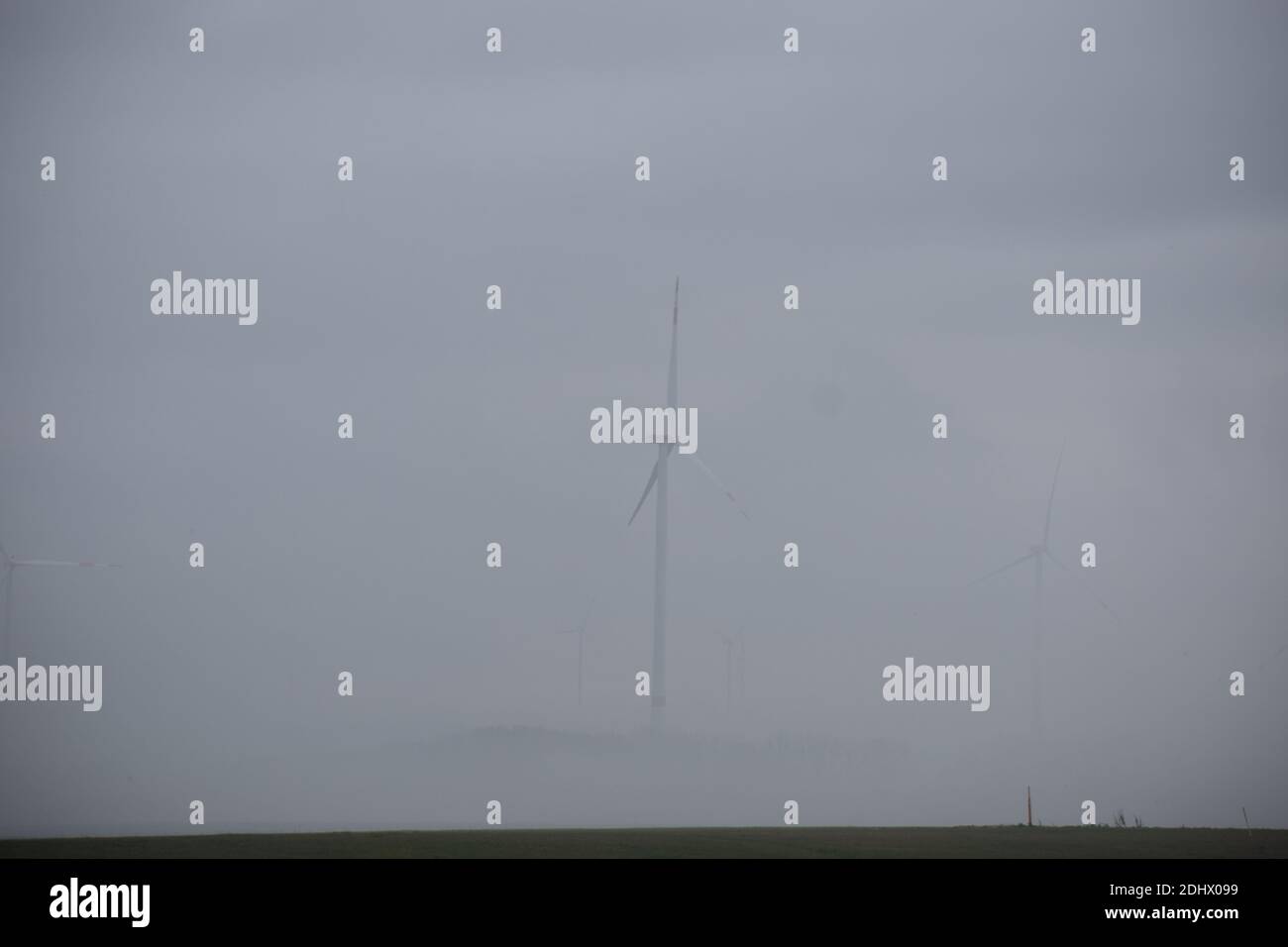 wind energy in the fog Stock Photo - Alamy