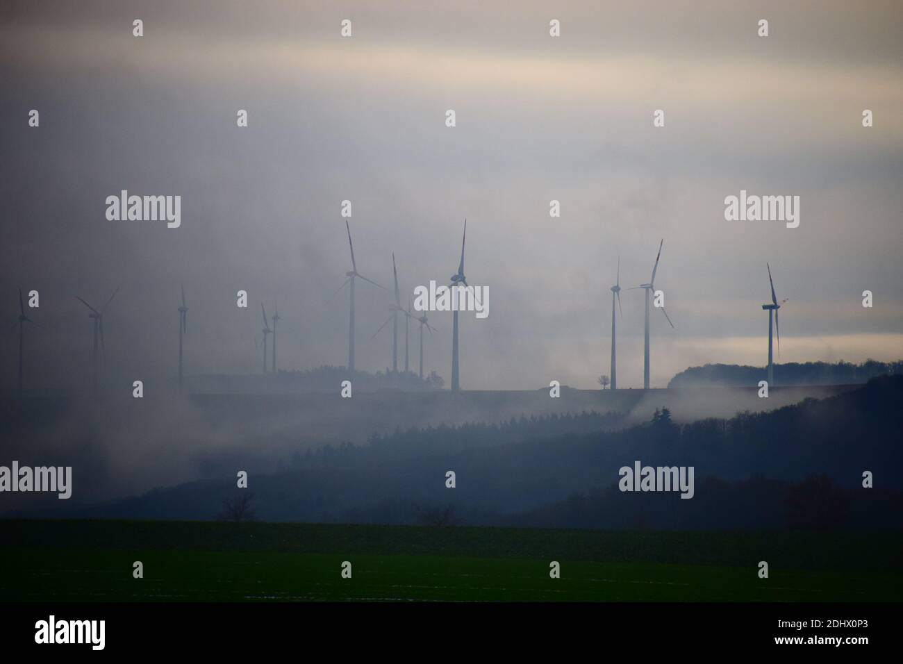 wind energy in the fog Stock Photo - Alamy