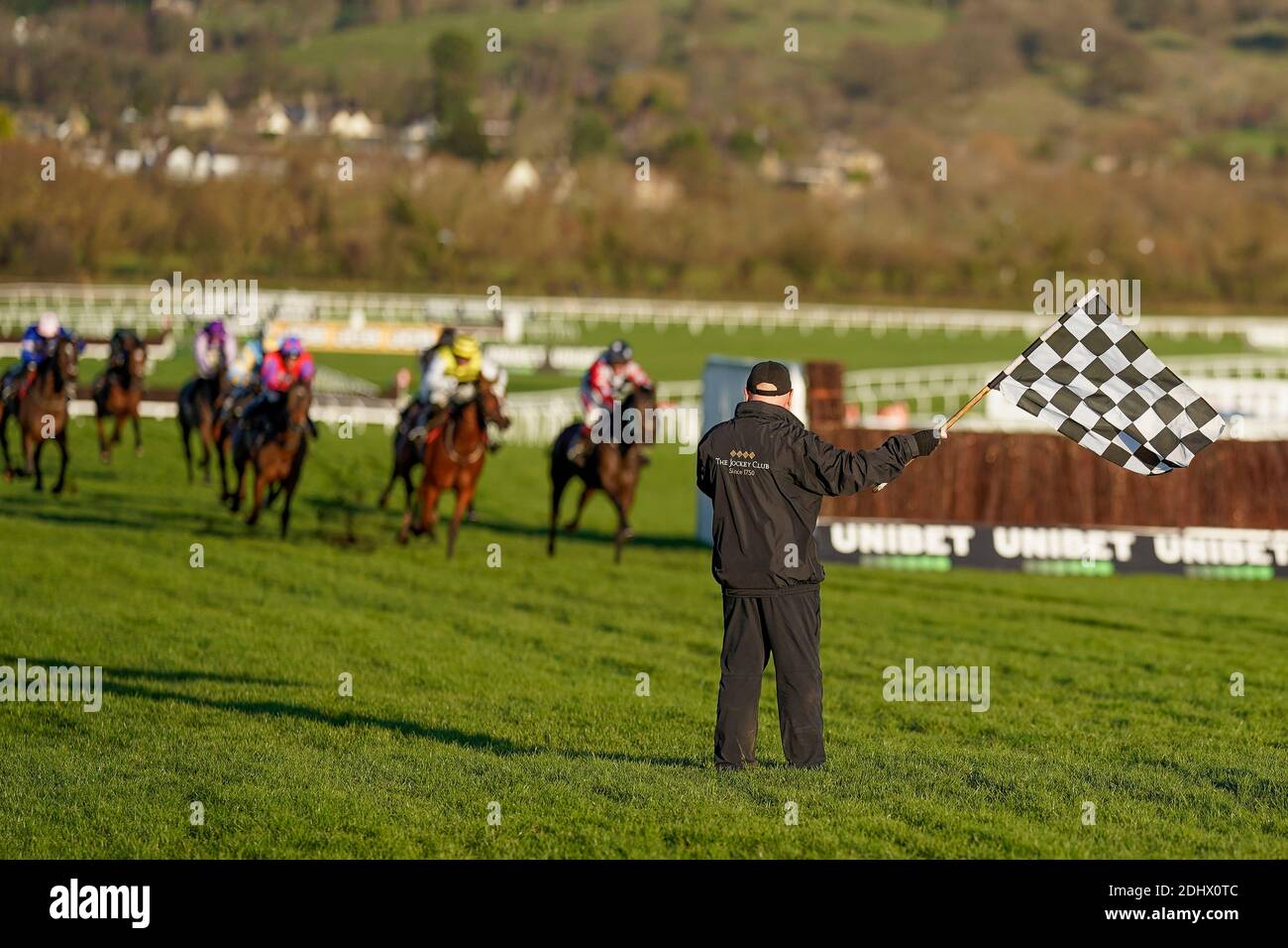 A general view as a member of the groundstaff waves the chequered flag ...