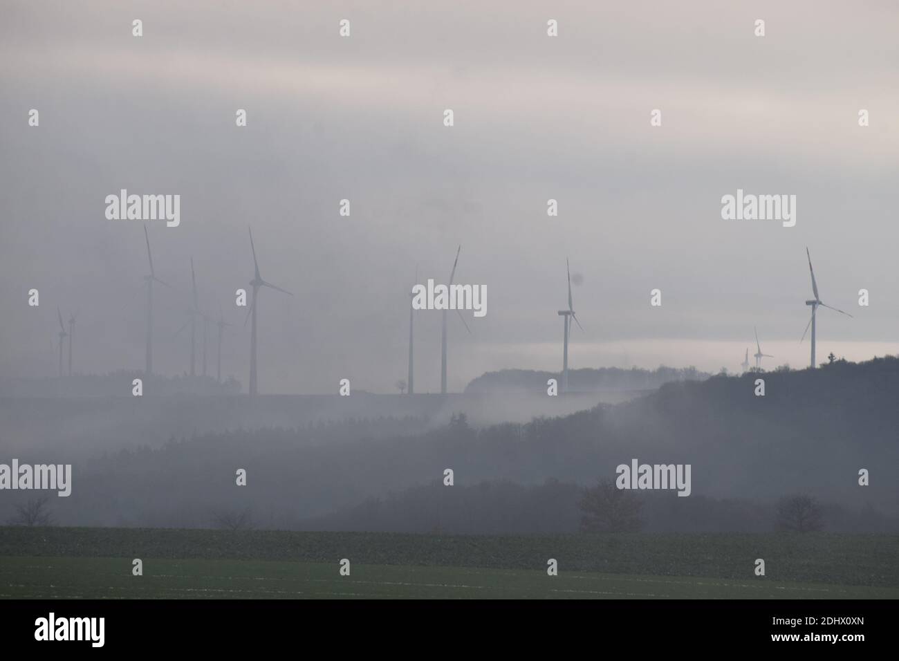 wind energy in the fog Stock Photo - Alamy