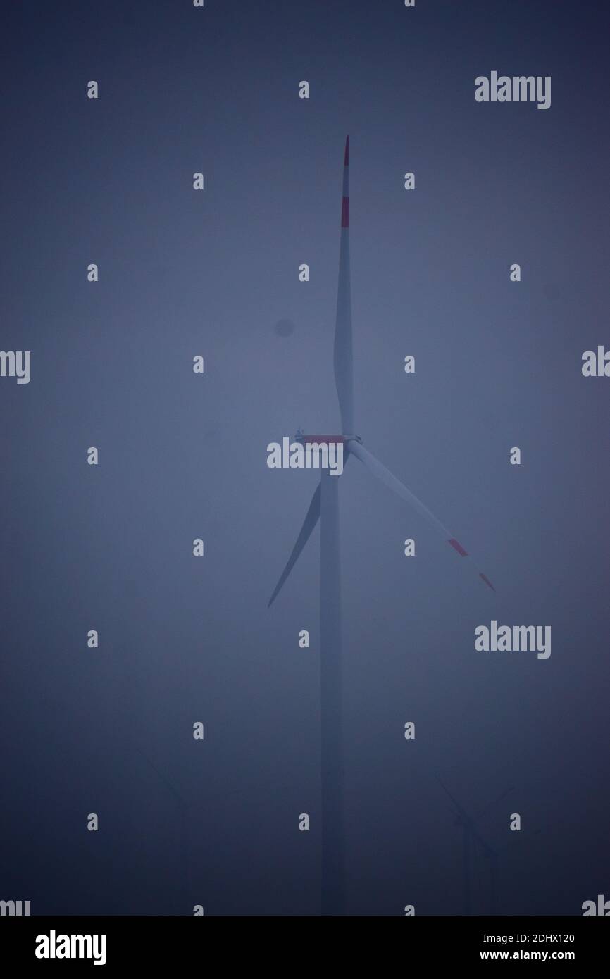 wind energy in the fog Stock Photo - Alamy