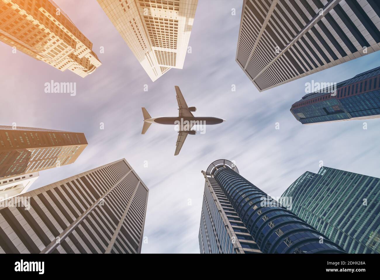 Aeroplane flying above buildings hi-res stock photography and images ...