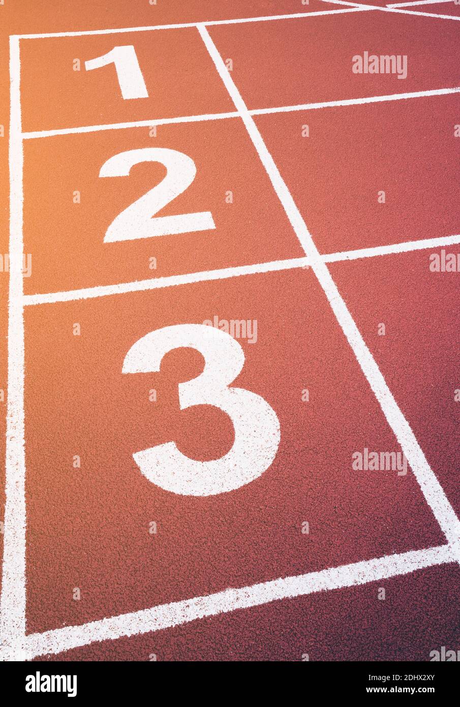 Running track number one two three in a stadium Stock Photo - Alamy