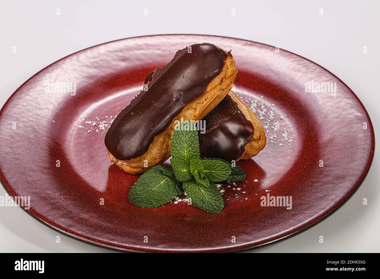 Sweet eclair dessert for gourmet served mint Stock Photo - Alamy
