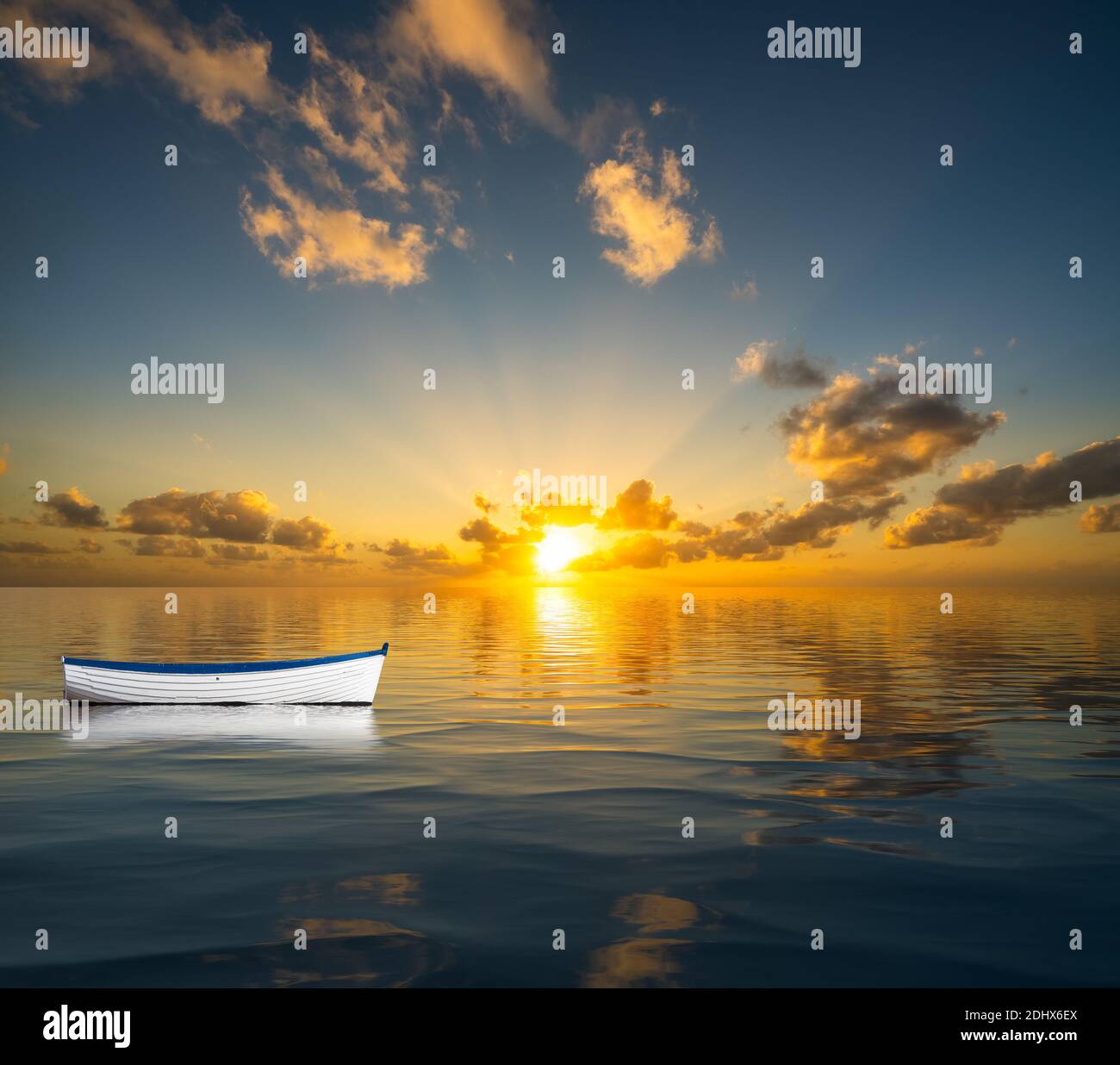 White rowing boat without people drifting on the open sea towards a ...