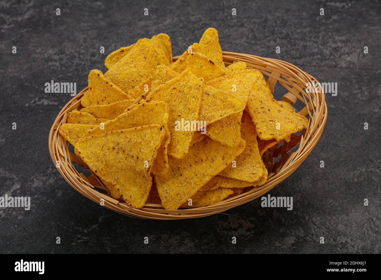 Mexican crunchy corn nachos triangle heap Stock Photo - Alamy