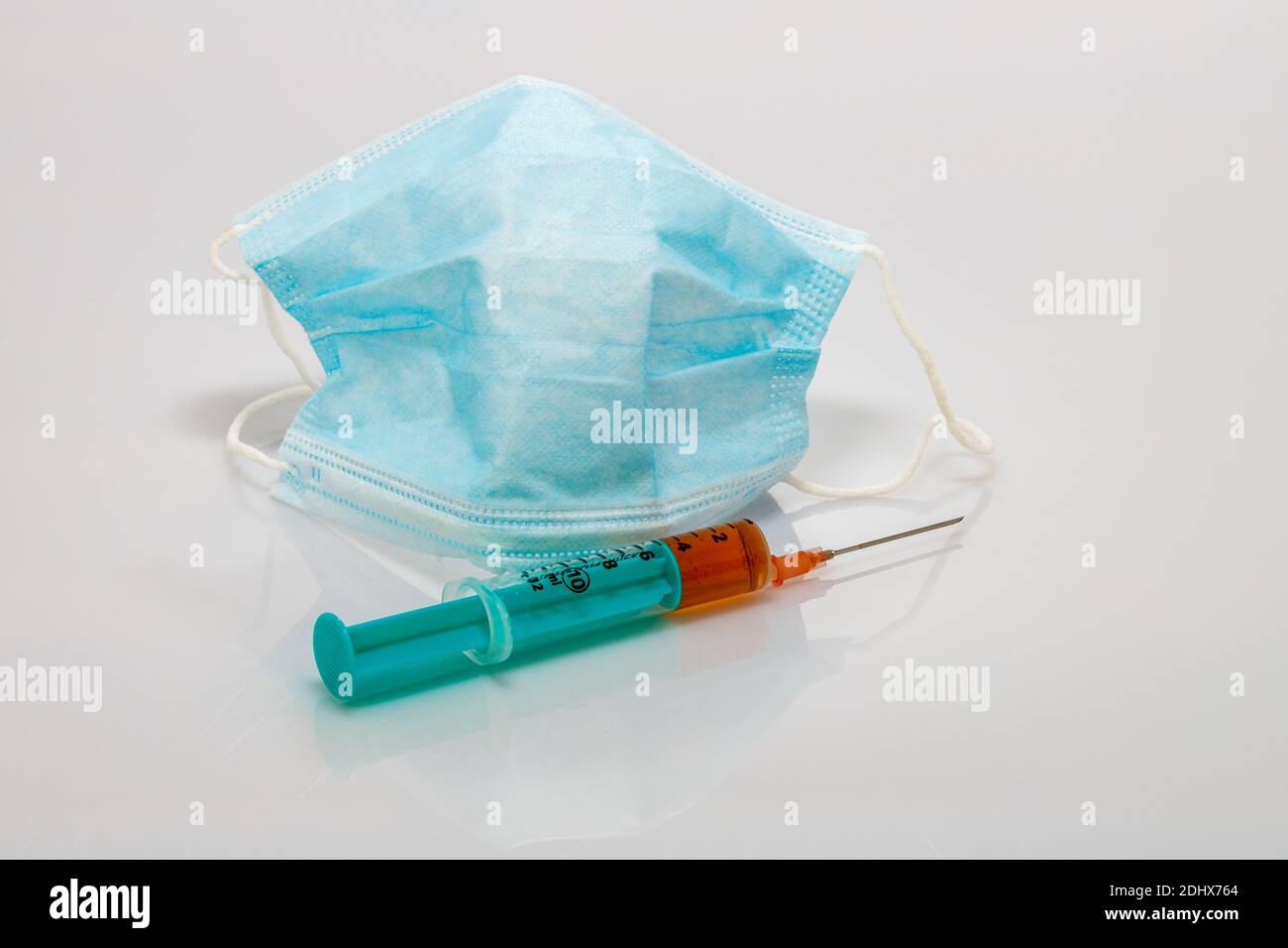 Protection with injection and mask Stock Photo - Alamy