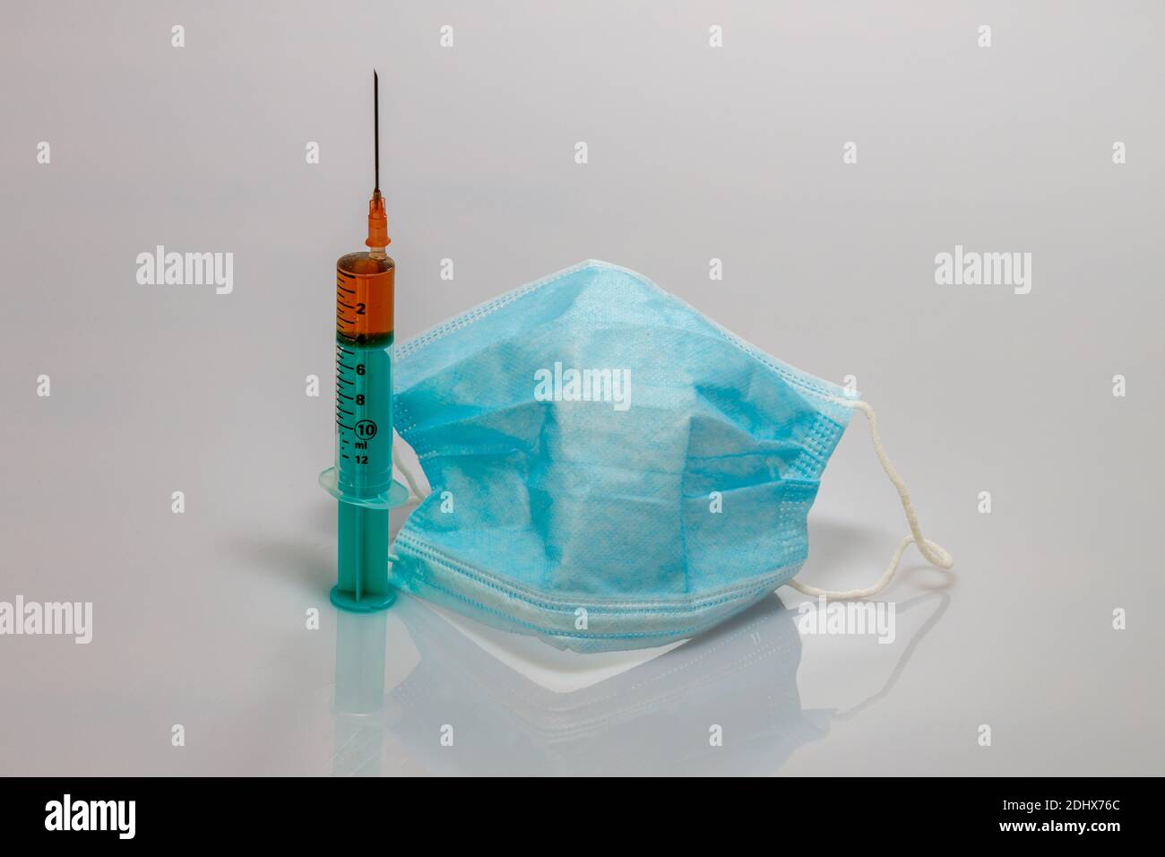 Protection with injection and mask Stock Photo - Alamy
