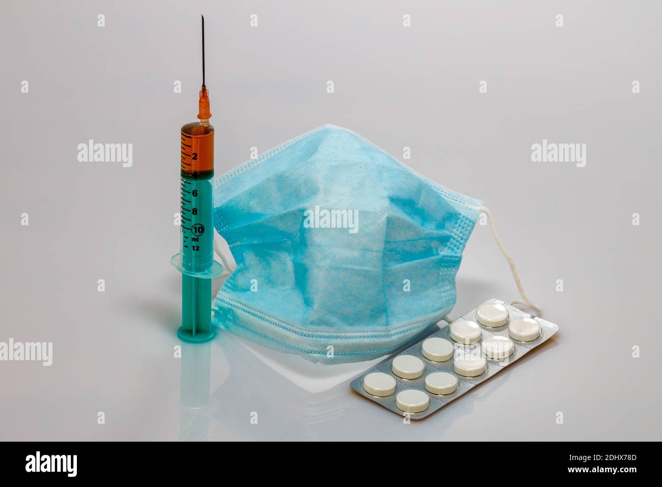 Protection with injection and mask Stock Photo - Alamy