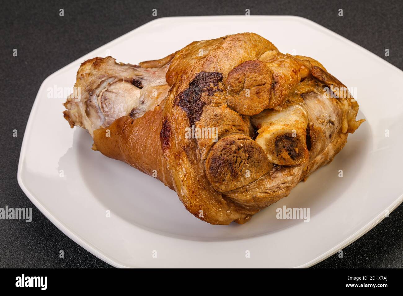 Baked pork knuckle with spices and herbs Stock Photo - Alamy
