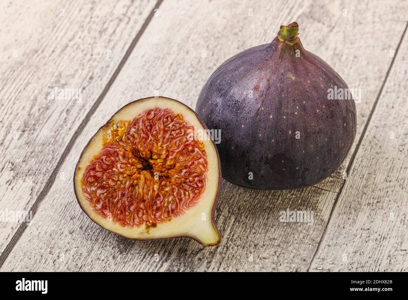 Sweet purple slice of fig fruit Stock Photo - Alamy