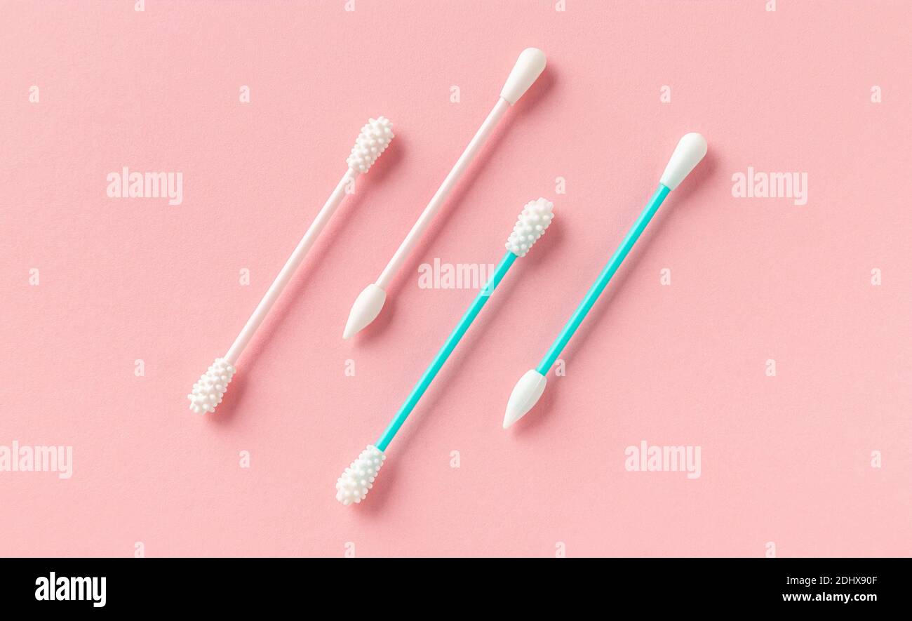 Reusable silicone swab on pink background. Alternative to cotton buds ...
