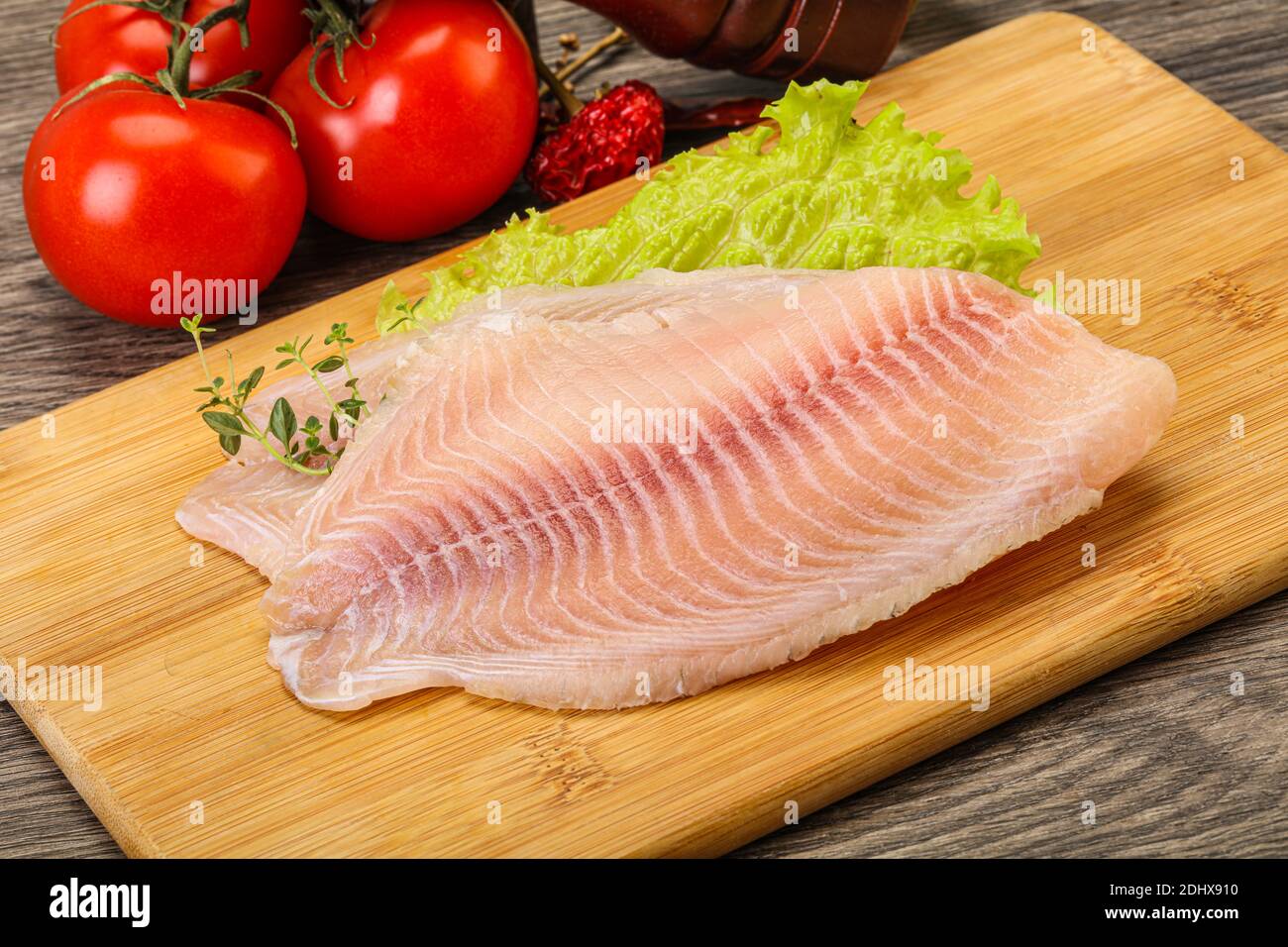 Raw tilapia fish fillet for cooking Stock Photo - Alamy