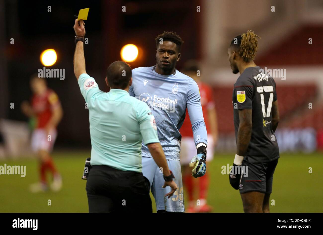 Nottingham Forest goalkeeper Brice Samba is shown a yellow card by ...