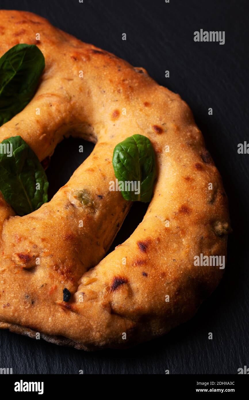 Food concept traditoin French Fougasse artisan flatbread on black slate ...