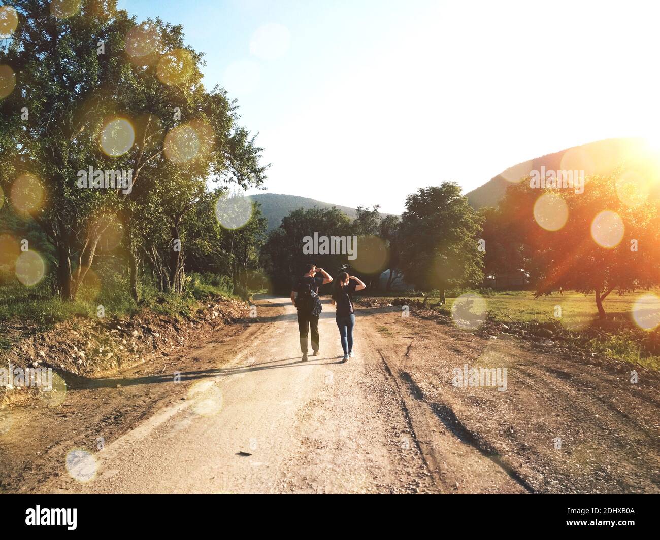 Young man walking along road hi-res stock photography and images - Alamy
