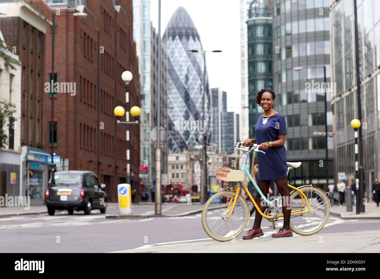 Woman wearing dress bicycle hi-res stock photography and images - Alamy
