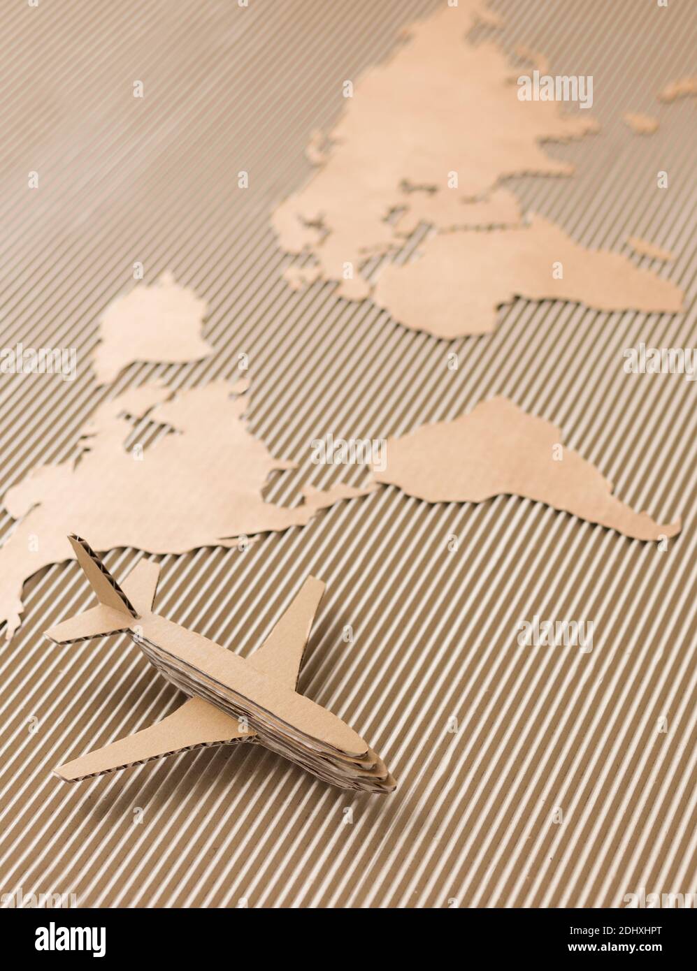 Airplane and world map made of cardboard Stock Photo - Alamy