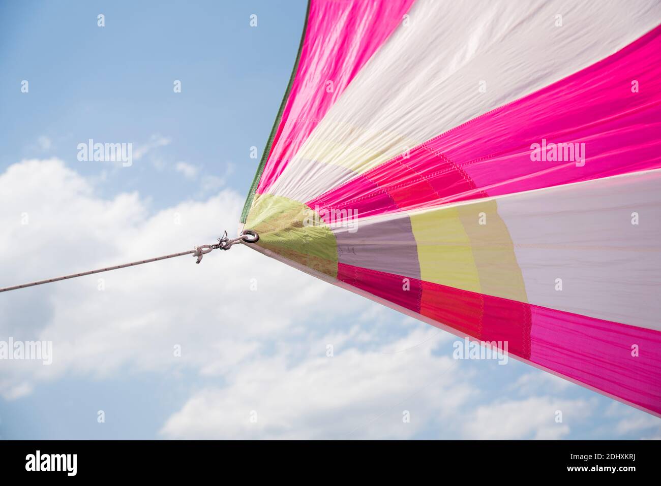 Colorful sails against a blue sky with white clouds, bright colors ...