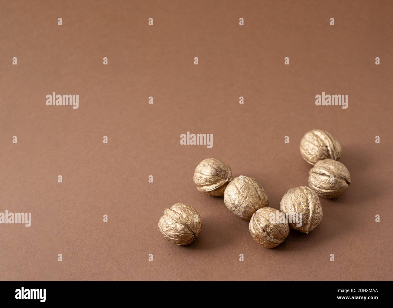 Golden walnut on brown background. copy space Stock Photo - Alamy