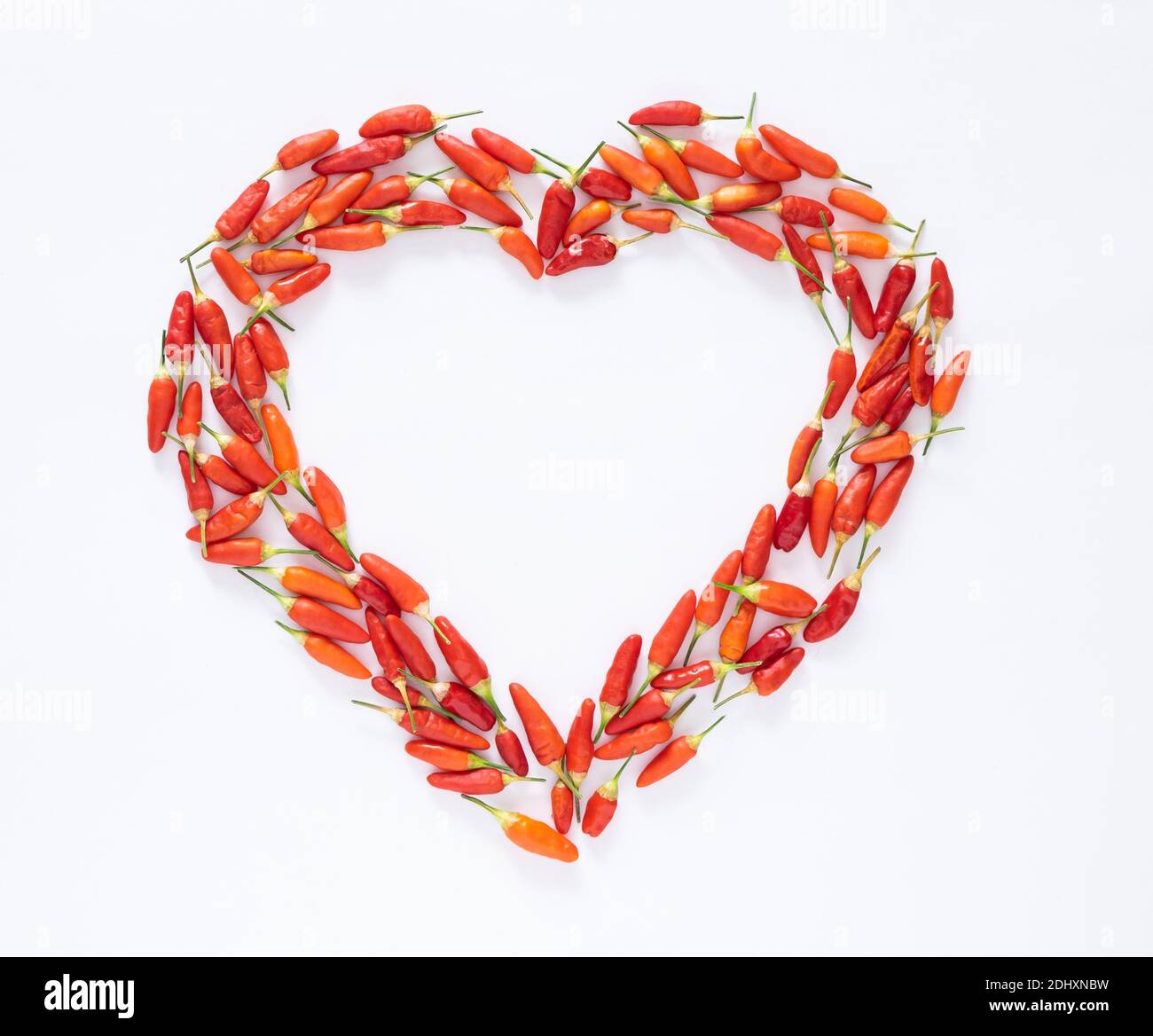 Love is spicy in flatlay chili pepper heart Stock Photo - Alamy