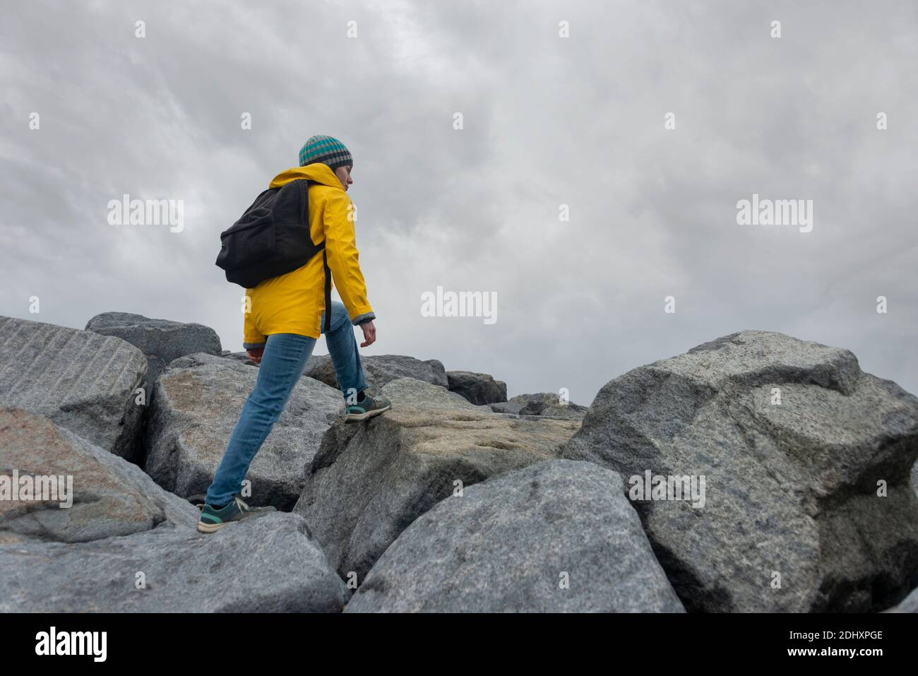 woman hiker climbing over rocks Stock Photo - Alamy