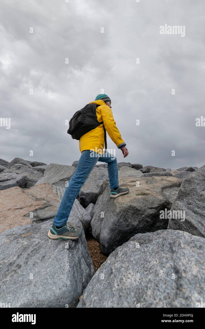 Woman hiking over rocks hi-res stock photography and images - Alamy