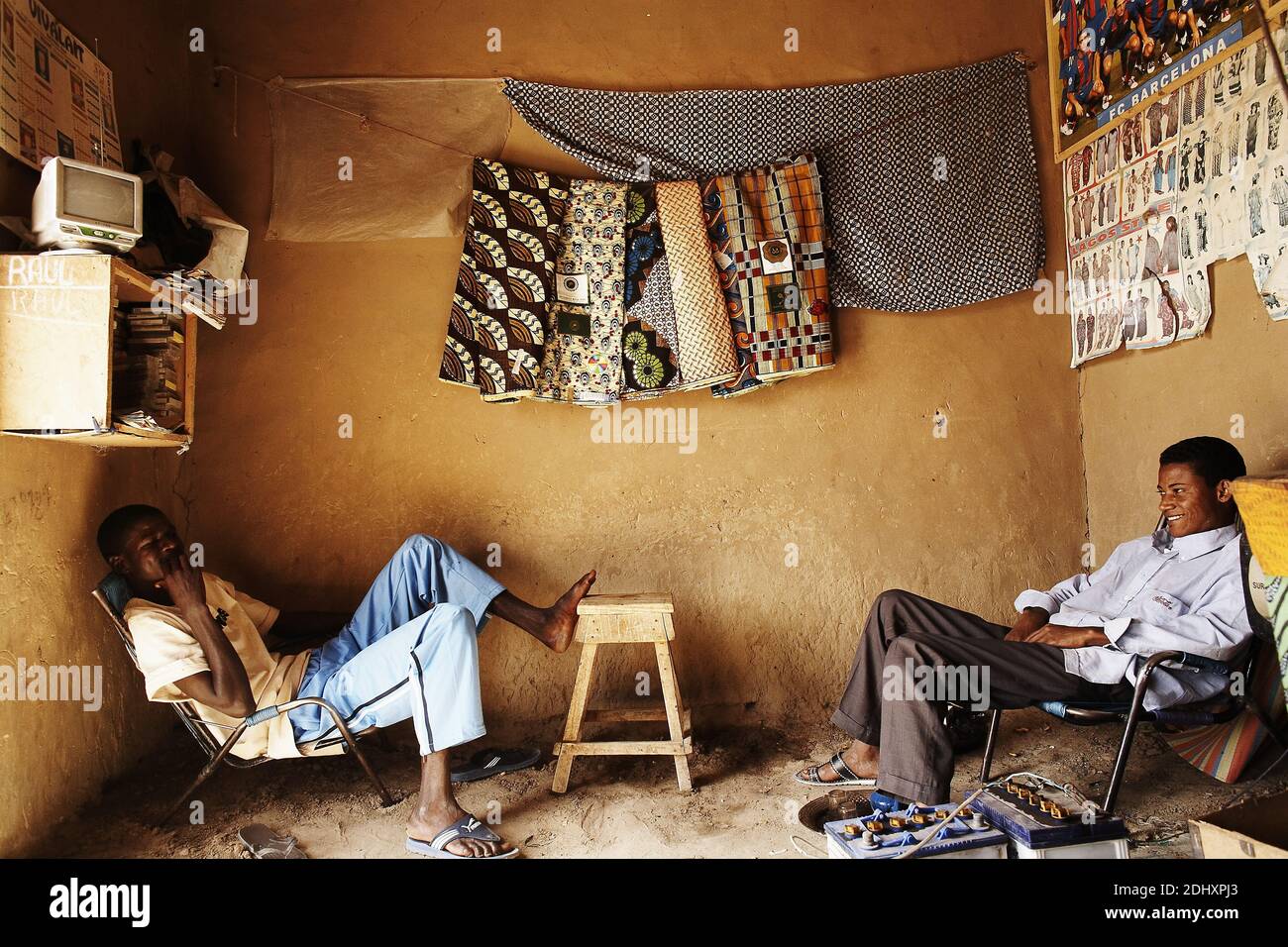 Two workers rest sitting in their workshop ,Mali, West Africa Stock ...