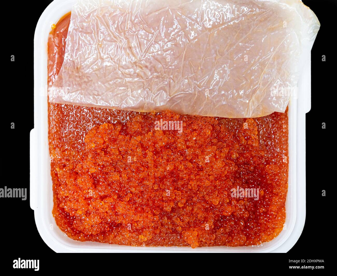 Red caviar background. Caviar in a big plastic container. Salmon roe ... Red caviar background. Caviar in a big plastic container. Salmon roe ...